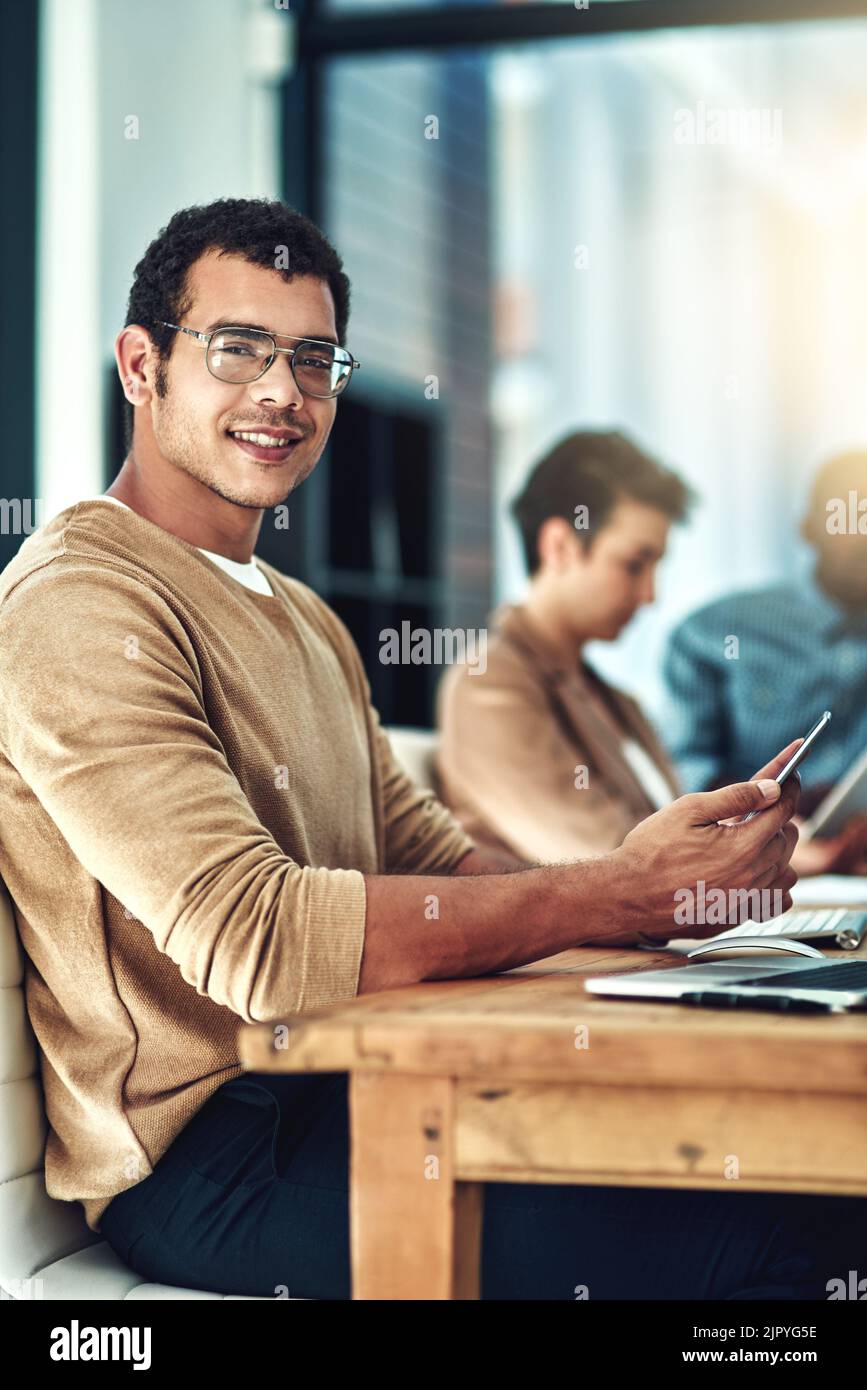 Networking with like-minded people online. a young designer using his ...