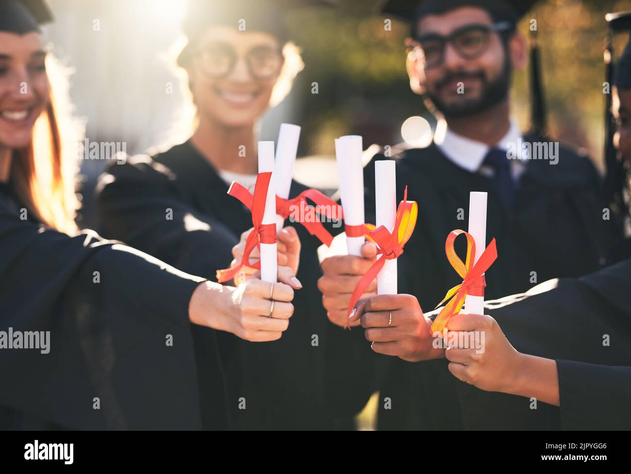 What you put in, you get out. a group of students holding their ...