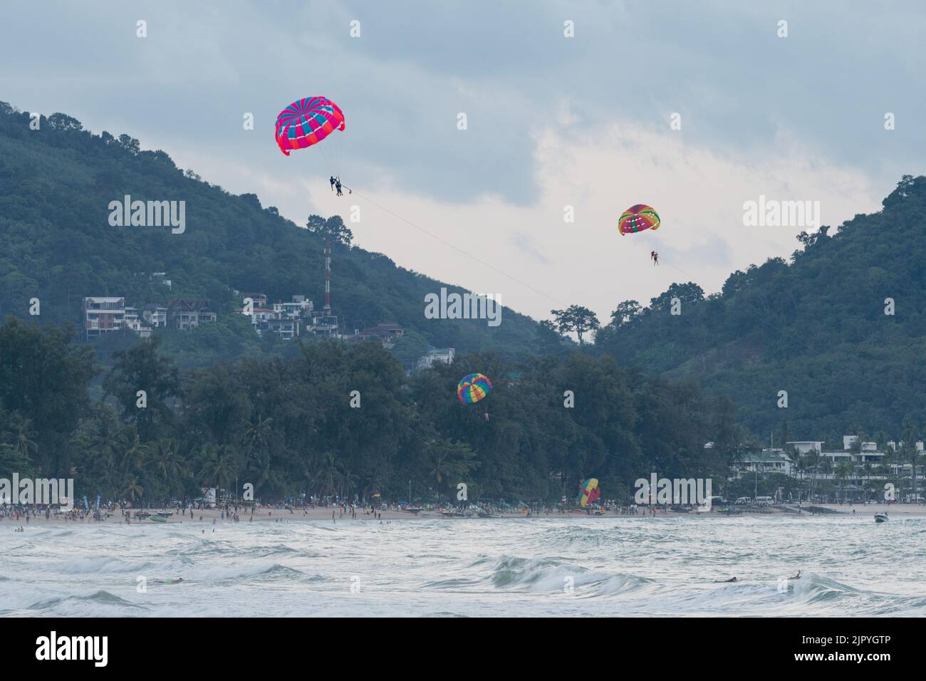Paragliding on the famous Patong beach Tourist are enjoying activities ...