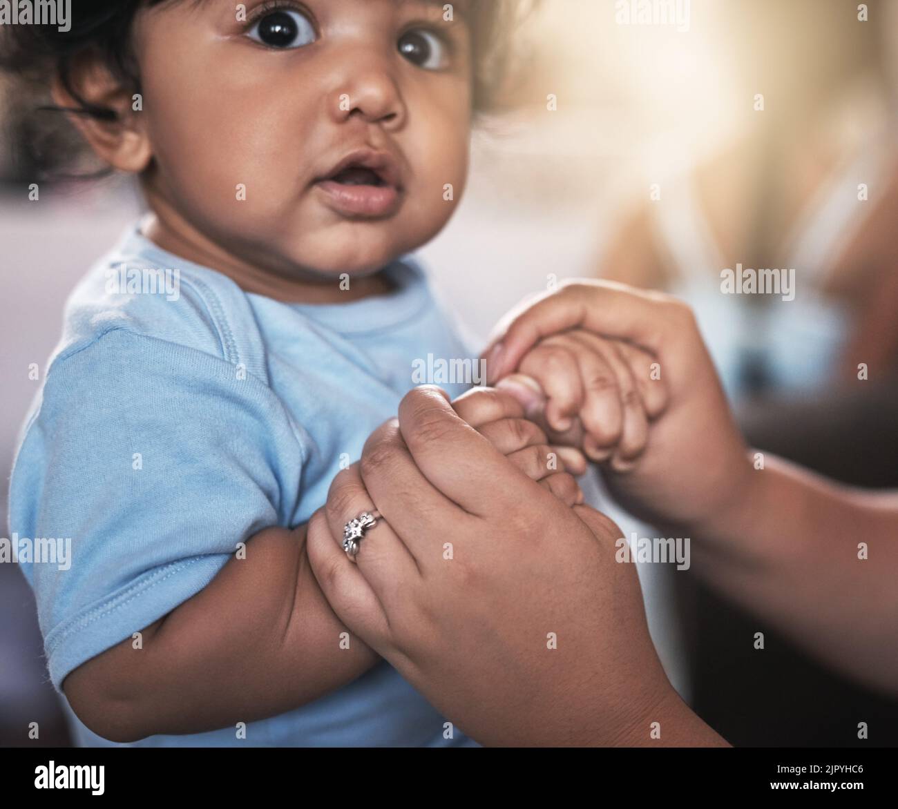 Completely cute and carefree. Portrait of an adorable baby boy playing ...
