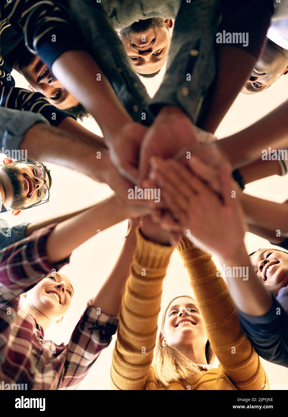 Together is how well go further. Low angle shot of a group of people ...