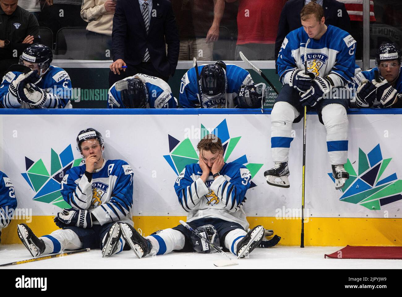 Finland players sit dejected after losing to Canada during overtime ...