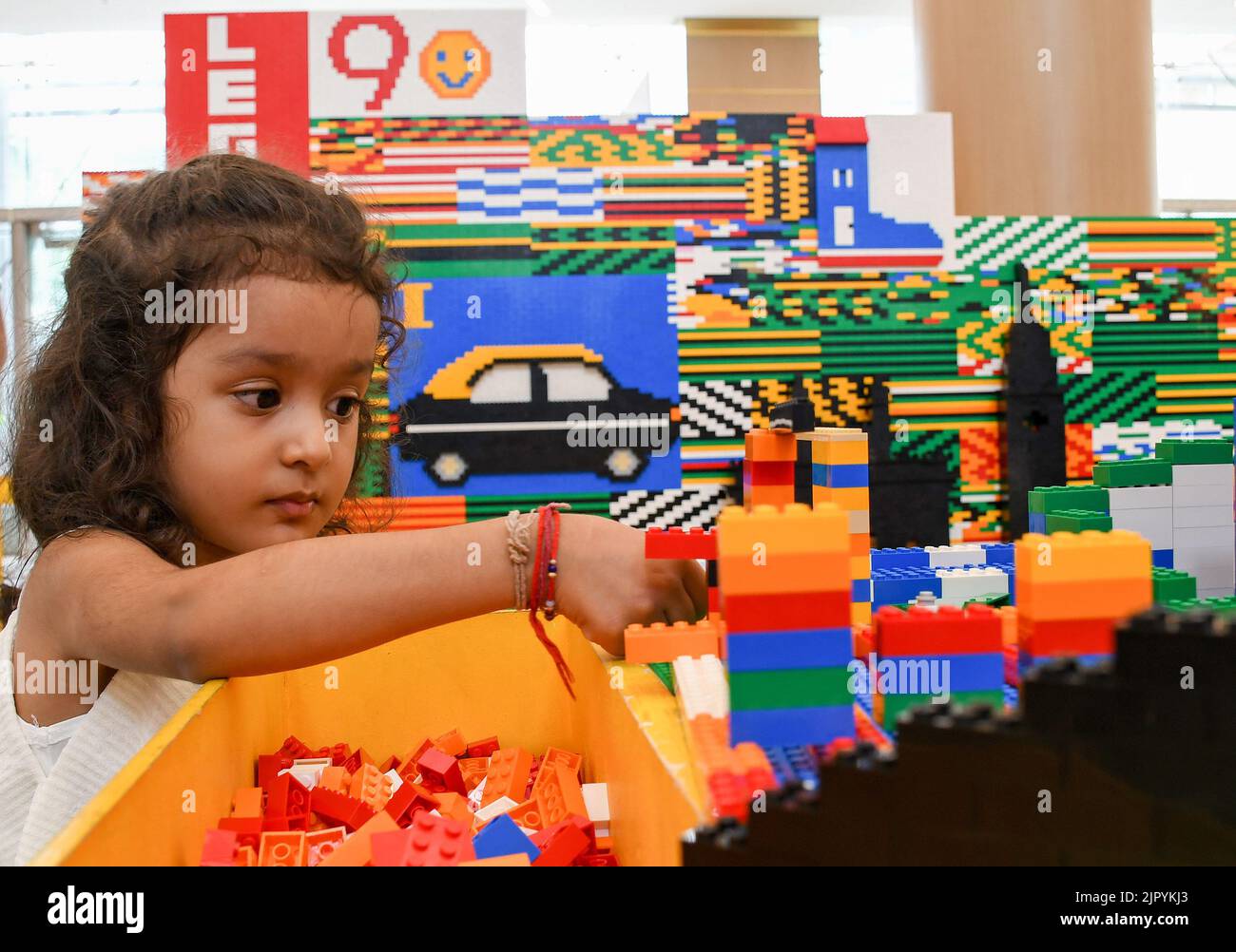 Mumbai, India. 20th Aug, 2022. A girl plays with Lego blocks at R City ...