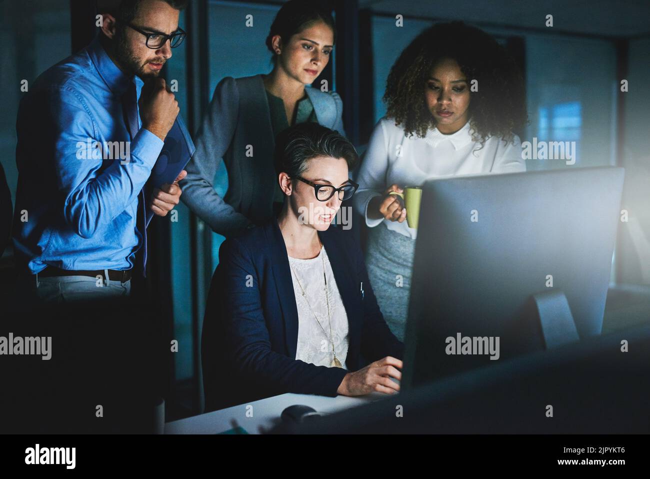 Working as efficiently as possible. colleagues standing together as ...