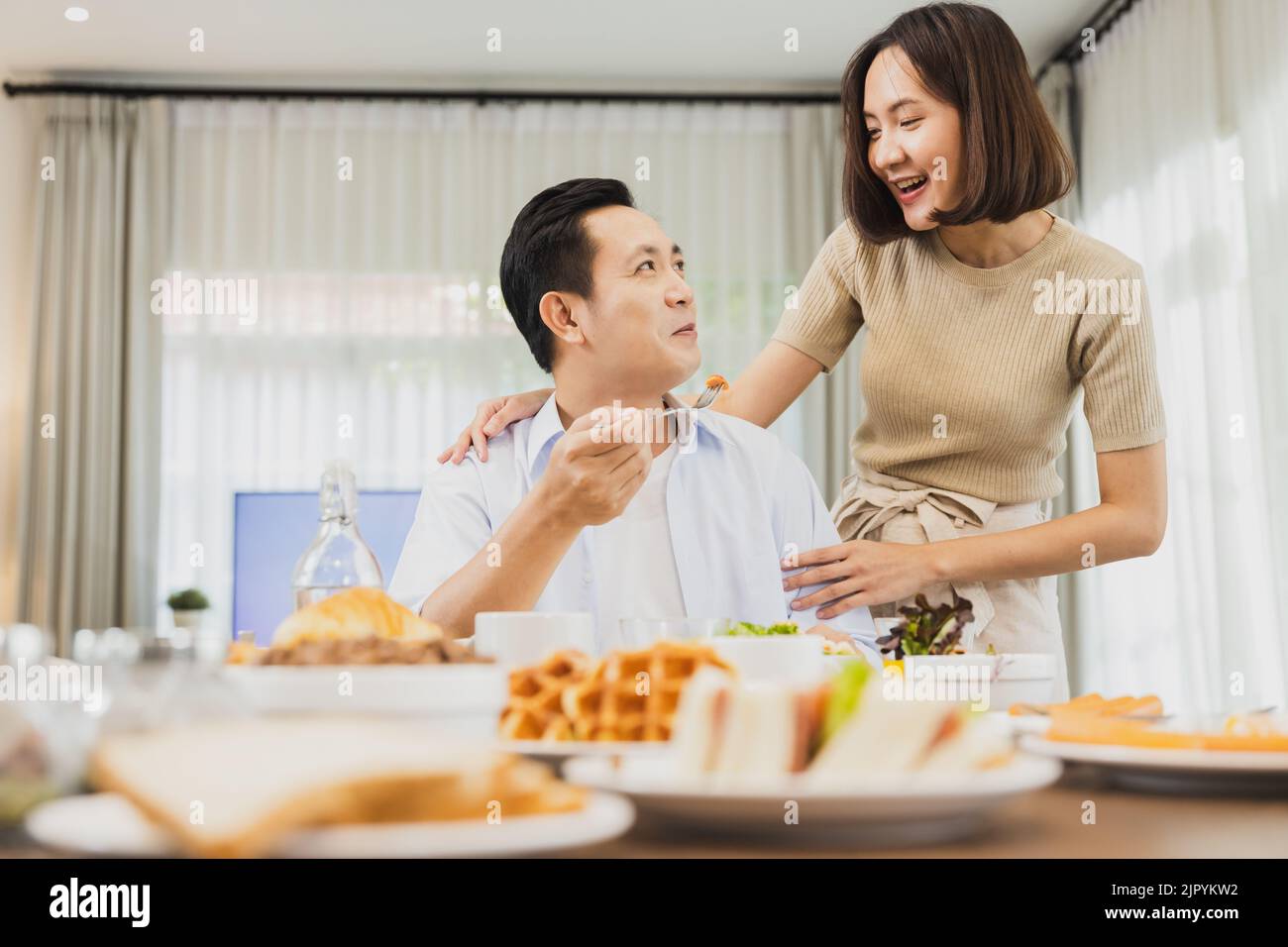 Asian wife talk with husband in breakfast, Happy family talking before ...