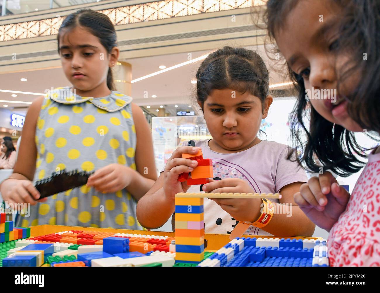 Children are seen using Lego blocks to make different objects at R City ...