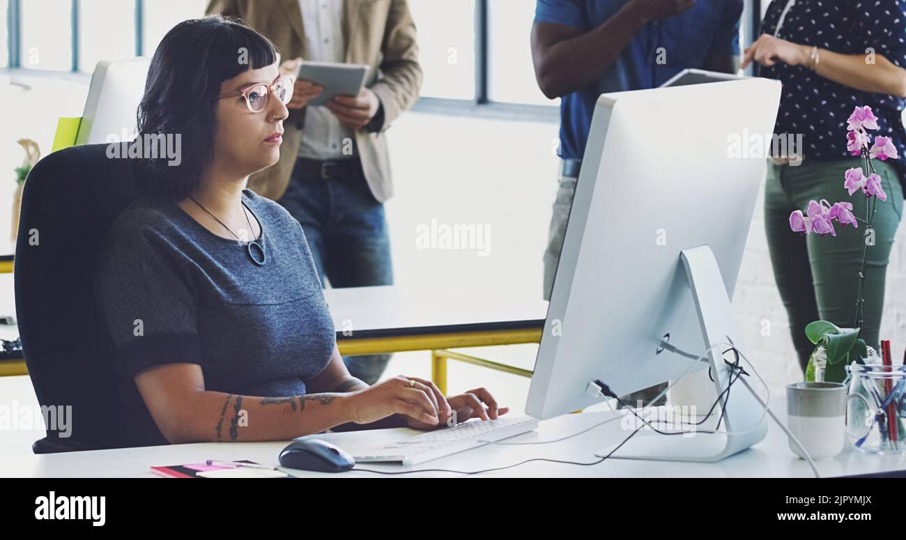Hard work is its own reward. an attractive young businesswoman working ...