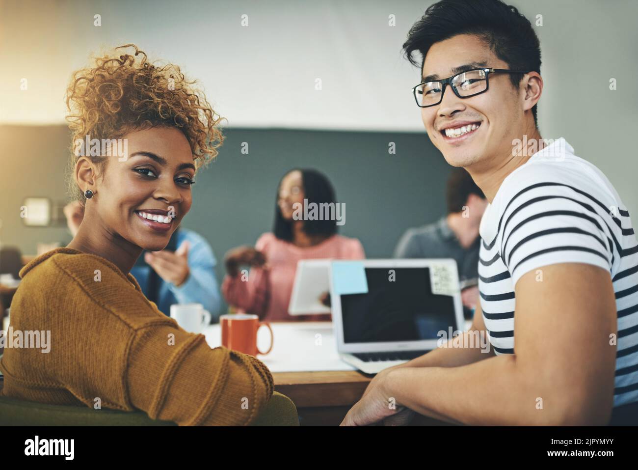 Together, well achieve excellence. Portrait of two young designers ...