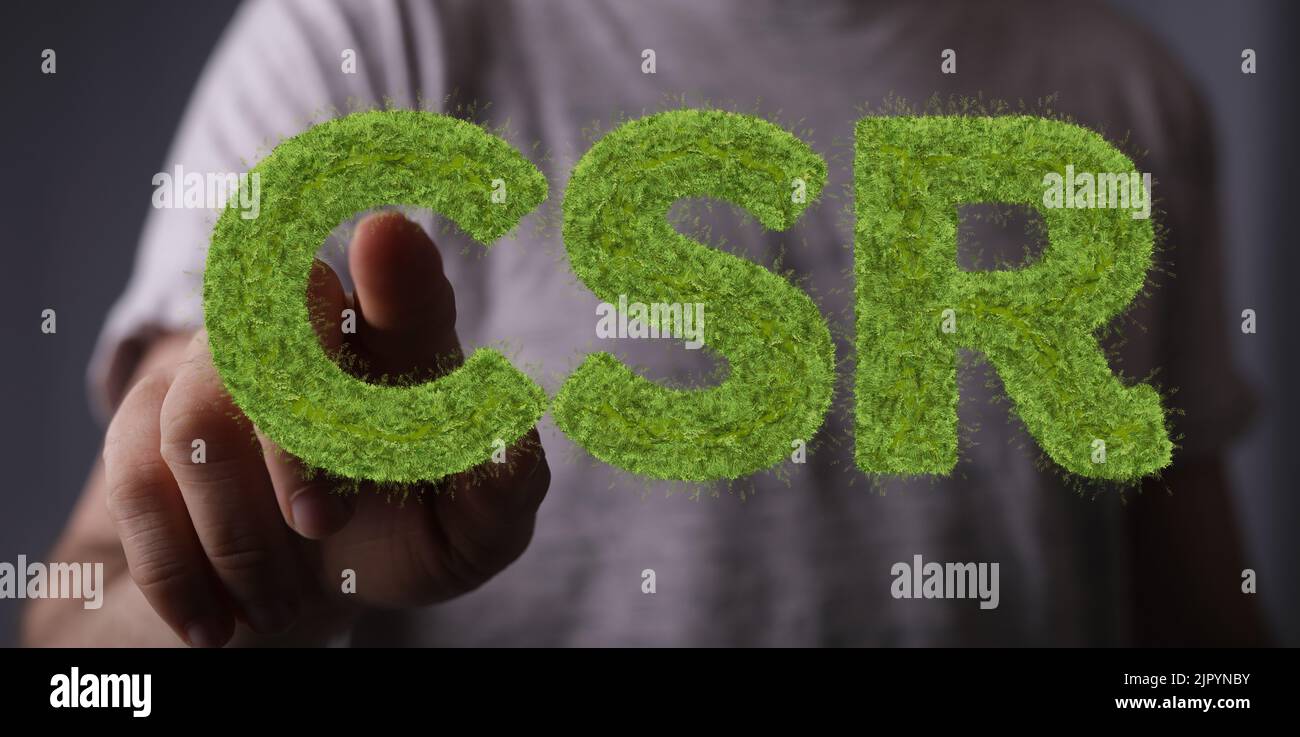 A man's hand pointing to hovering green CSR text Stock Photo - Alamy