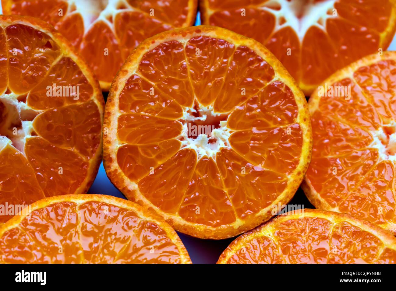 The halves of tangerines closed up Stock Photo - Alamy