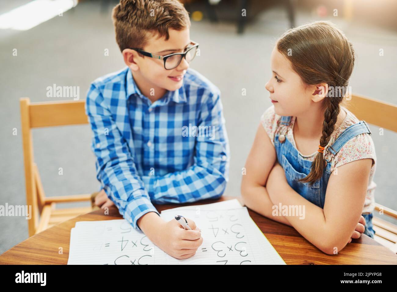 Is that really the answer. two young children working together inside ... Is that really the answer. two young children working together inside ...