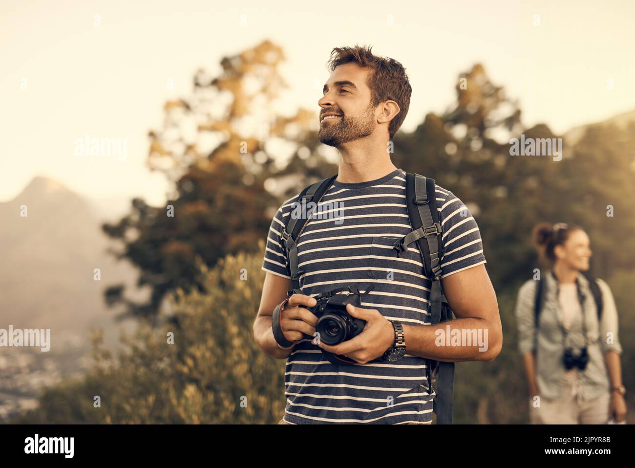 Theres so much to see. a man out hiking with his girlfriend following ... Theres so much to see. a man out hiking with his girlfriend following ...
