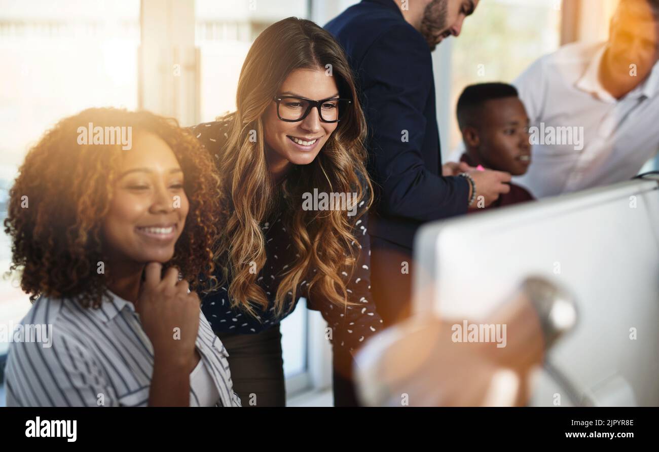 Collaboration produces better outcomes. two designers working together ...