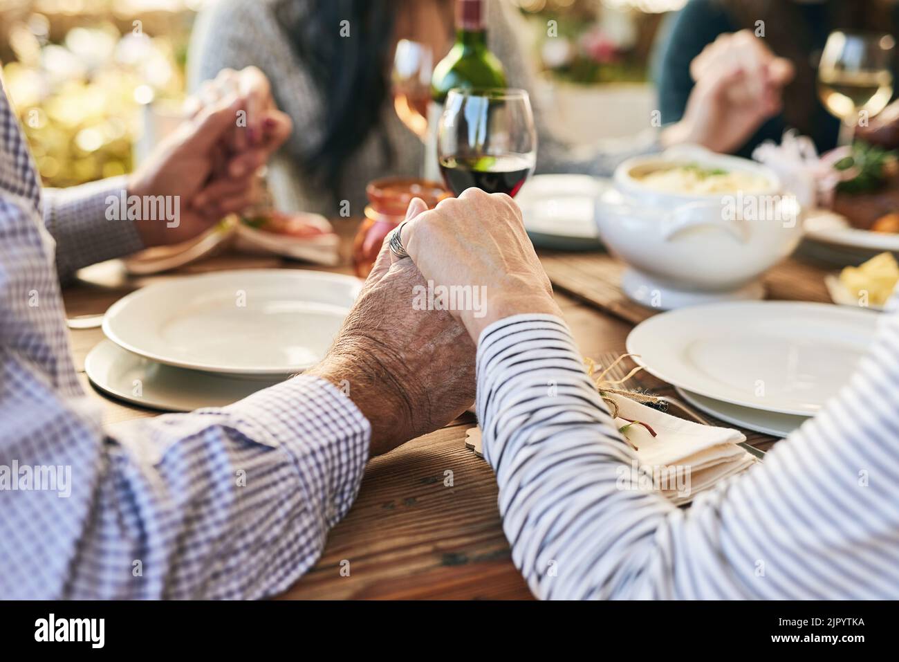 The family joining hands. two unrecognizable people holding hands at a ...