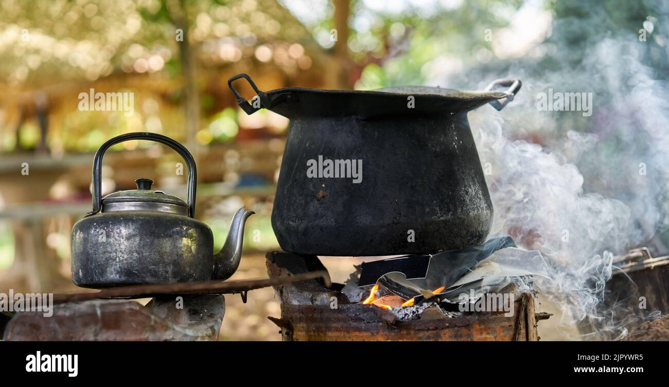 A big black pot and old kettle on an outdoor fire Stock Photo - Alamy