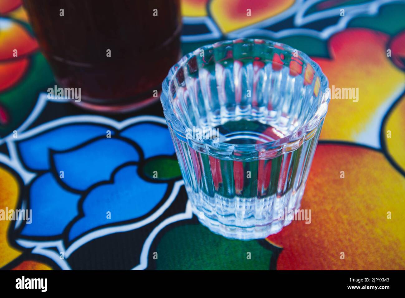A glass of Mezcal on a table at a bar in Oaxaca City, Mexico Stock ...