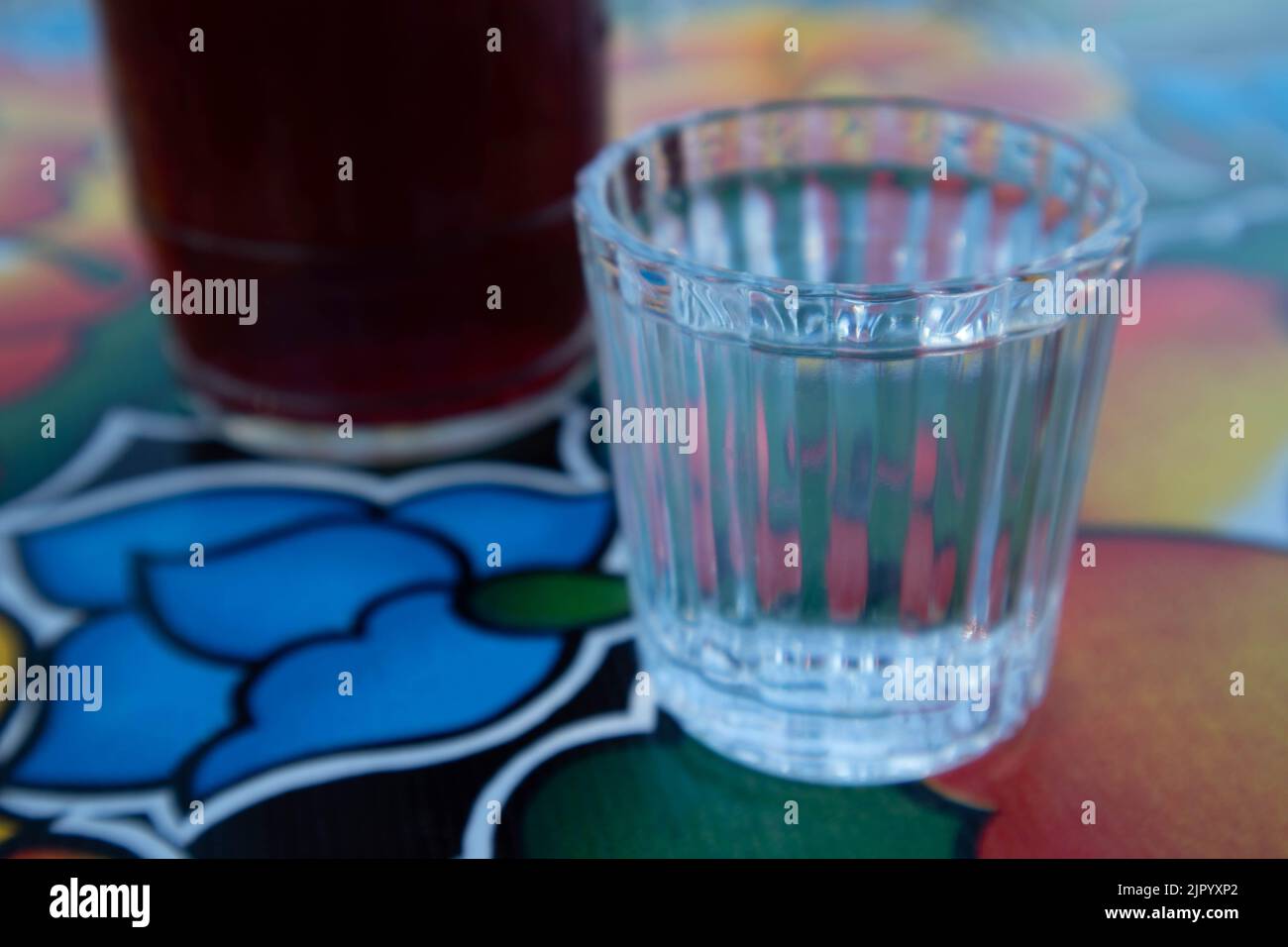 A glass of Mezcal on a table at a bar in Oaxaca City, Mexico Stock ...
