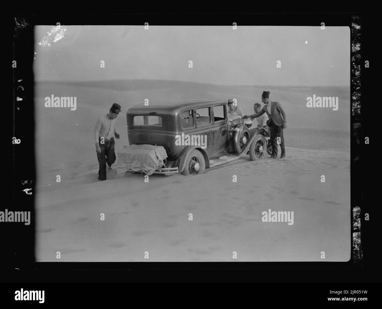 To Sinai by car. Car stuck in the midst of a sand dune. Sand drifts across the road Stock Photo ...