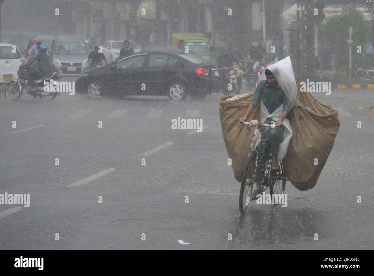 Lahore, Punjab, Pakistan. 20th Aug, 2022. Pakistani people on their way ...