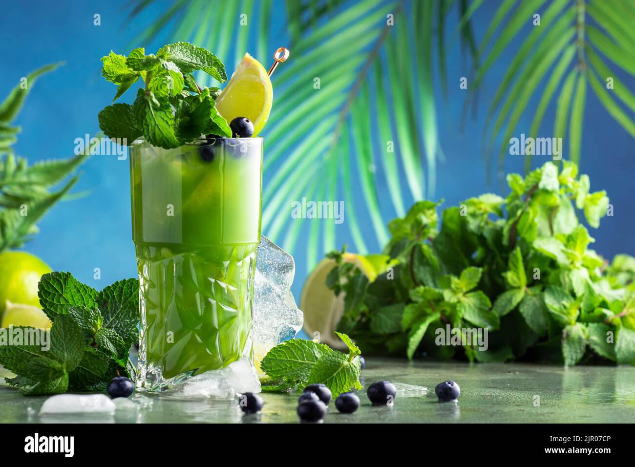 Green alcoholic cocktail with gin, tequila, liquor, juice, lime ...