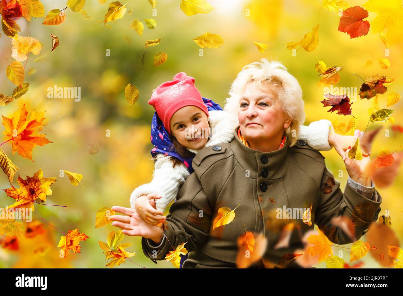 Grandmother with granddaughter in autumn park. Generation and family ...