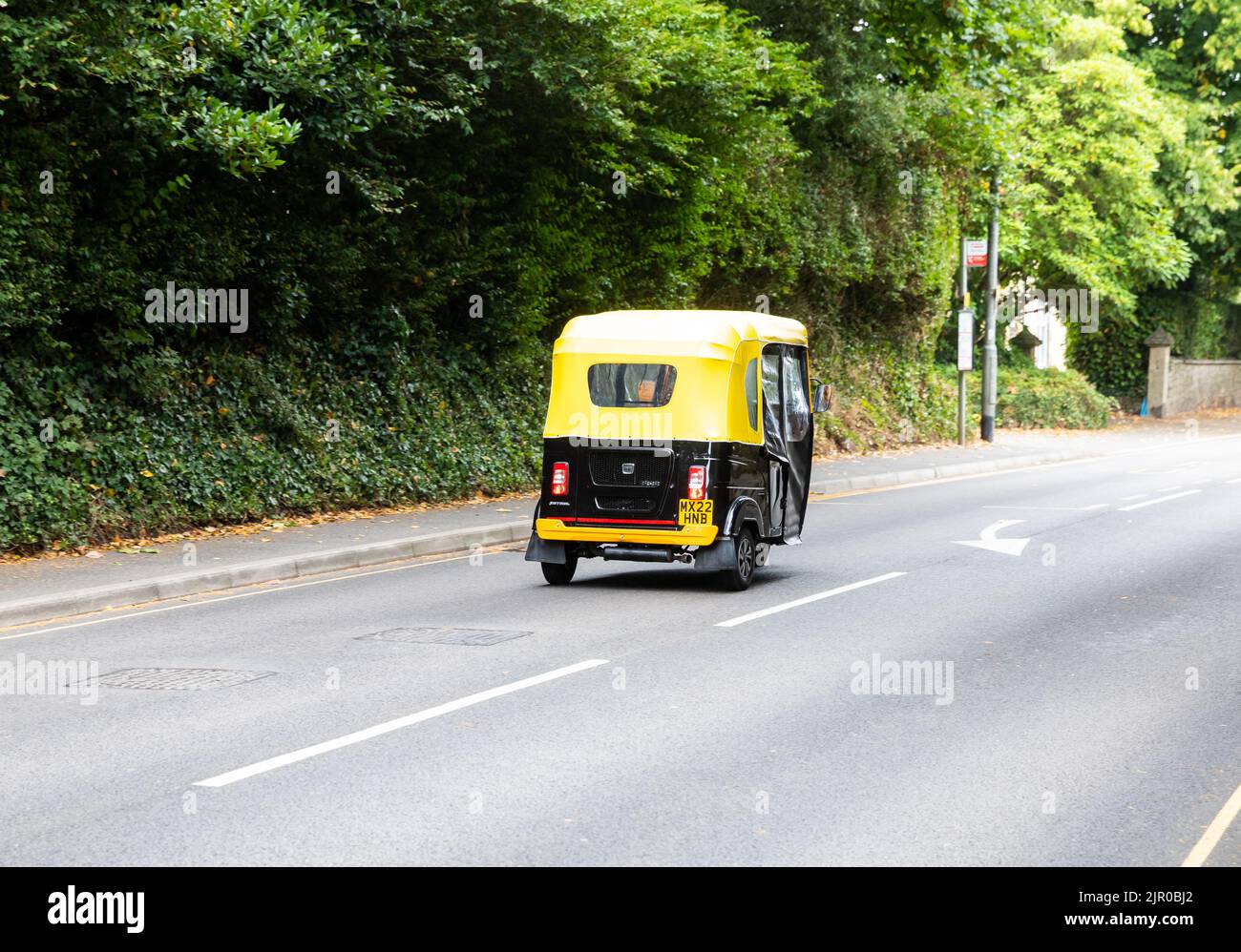 Black and yellow tuk tuk in Camborne Cornwall Stock Photo - Alamy