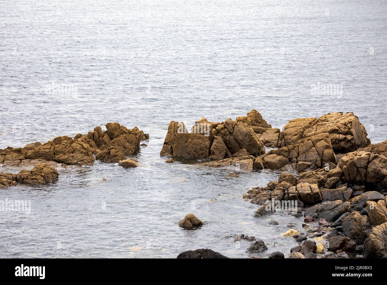 Sea defence rocks in Coverack, Cornwall, UK Stock Photo - Alamy