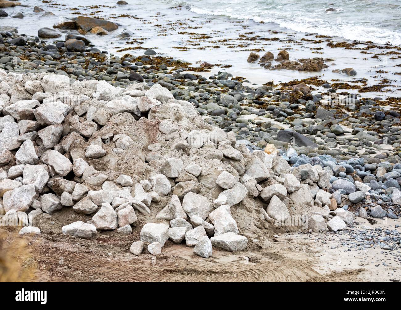 Sea defence rocks in Coverack, Cornwall, UK Stock Photo - Alamy