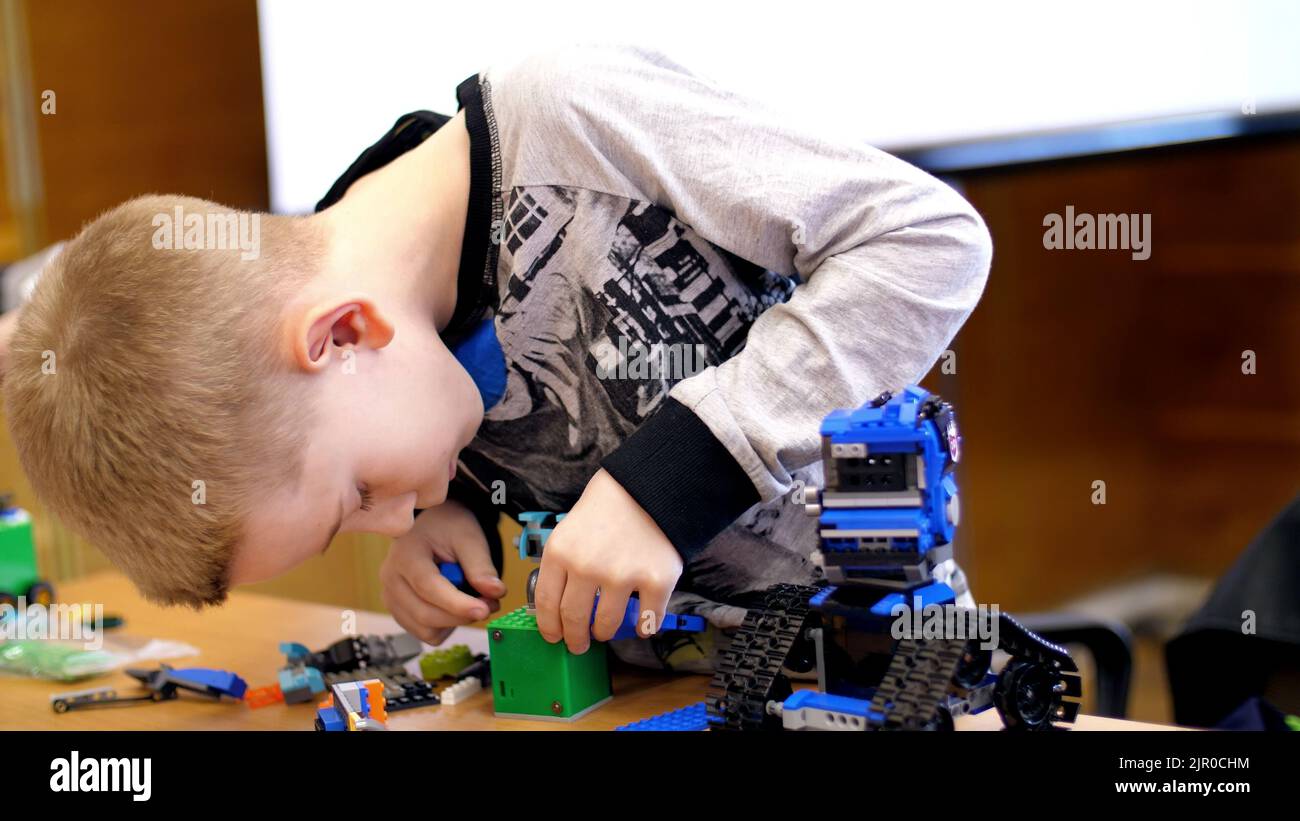 the boy of 10 years, plays in the designer from cubes, plates, circuits ... the boy of 10 years, plays in the designer from cubes, plates, circuits ...