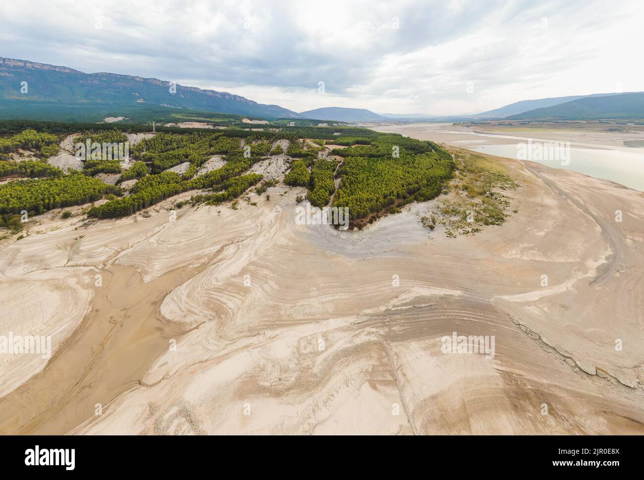 Aerial view of the Yesa reservoir and Aragón river with little water ...