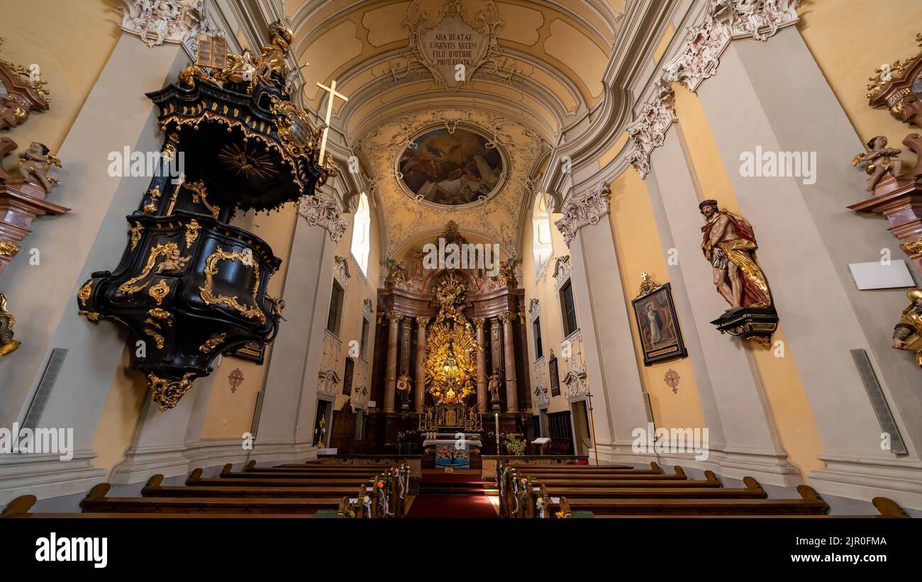 An interior view of majestic Christian church with old sculptures ...