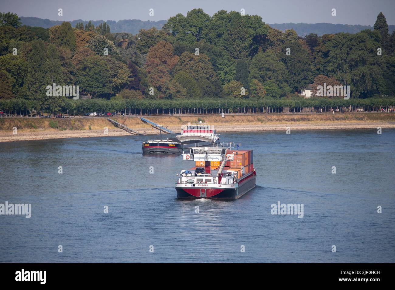 Bonn, Germany. 21st Aug, 2022. Cargo ships sail on the Rhine near Bonn ...