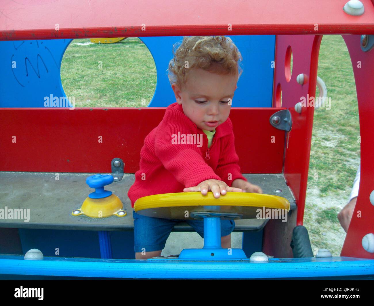 two year old boy having a good time in a park Stock Photo - Alamy