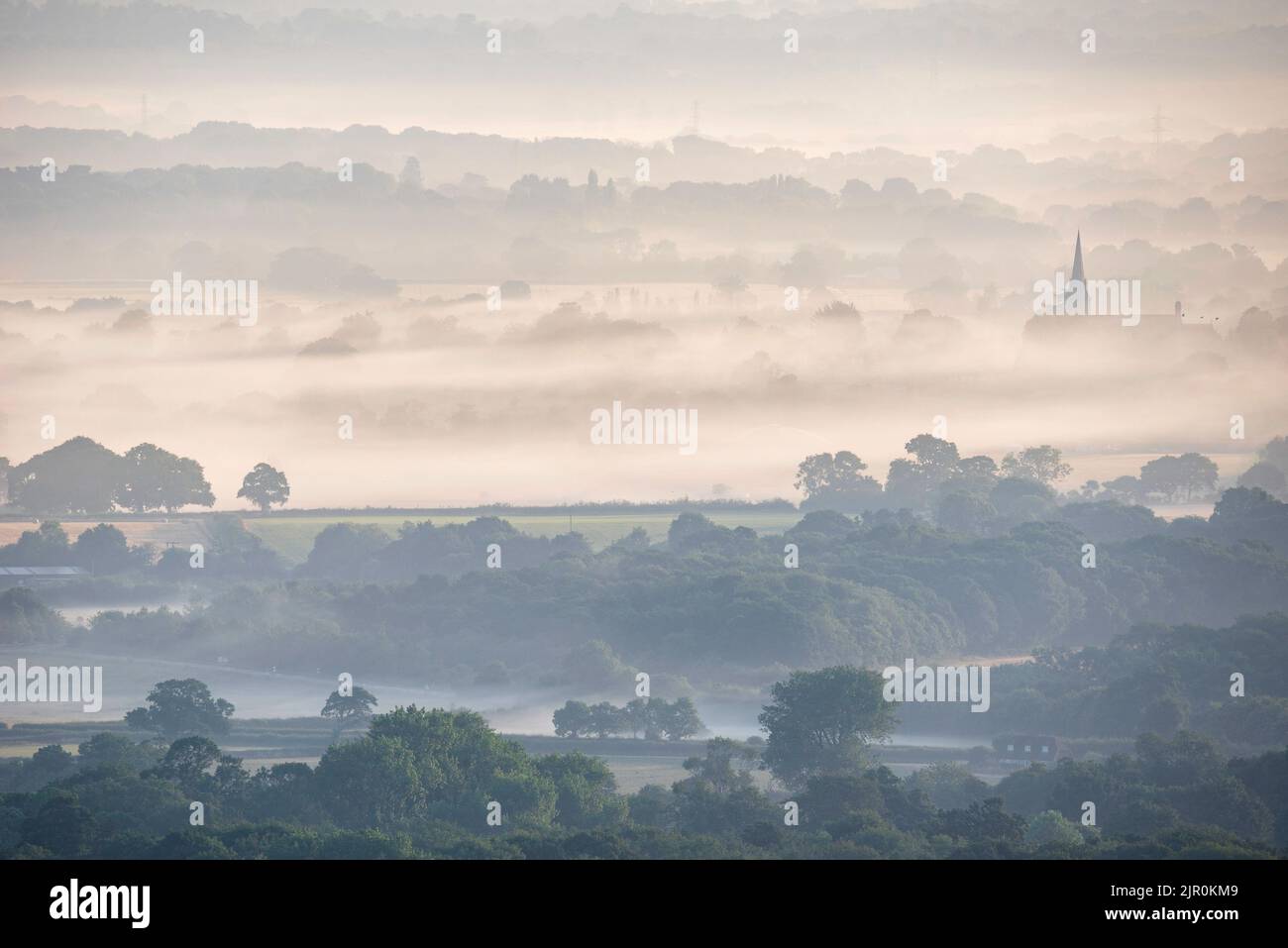 Stunning landscape image of layers of mist rolling over South Downs ...