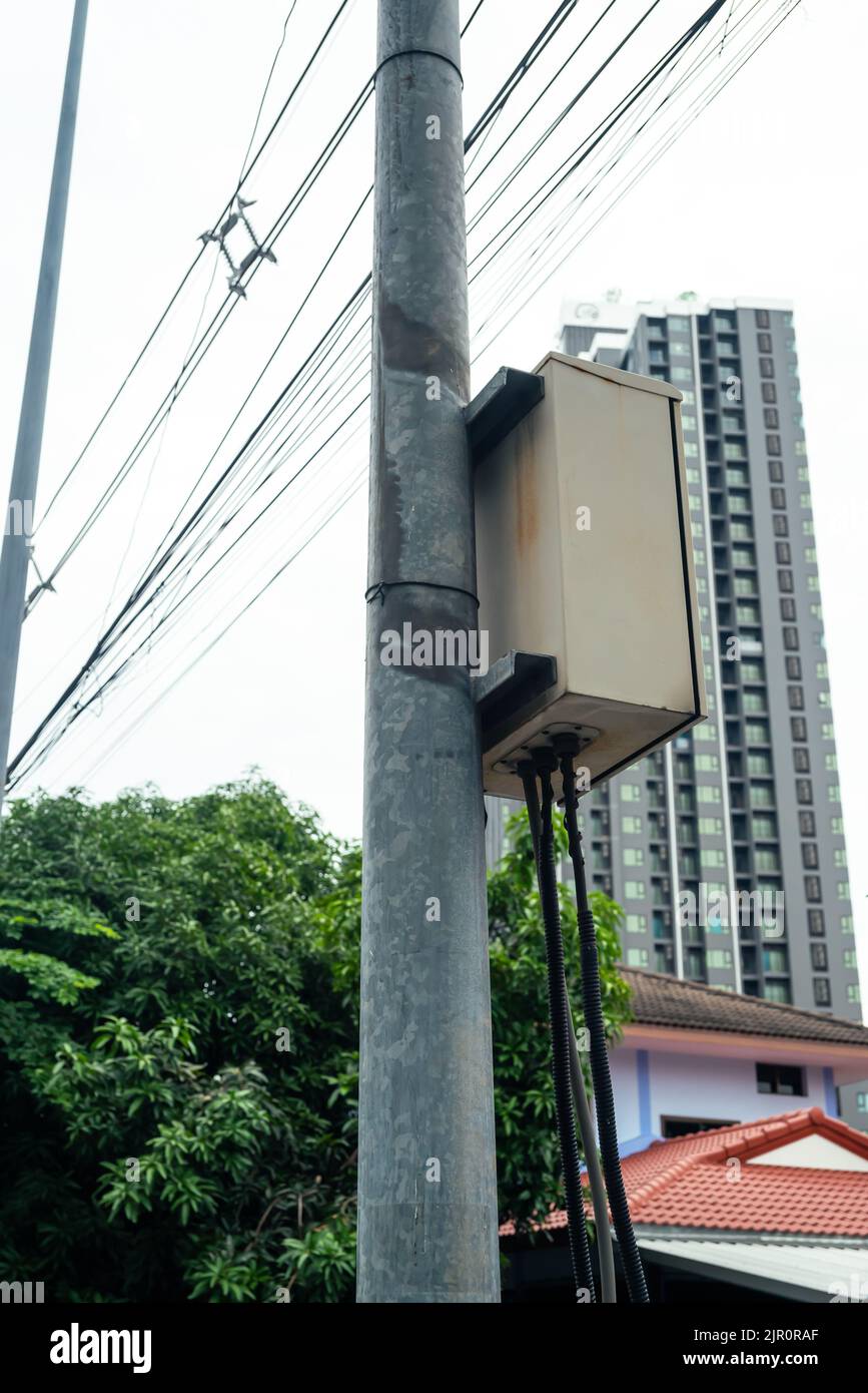 Electric conjunction box attached to the pole. Electrical post by the ...