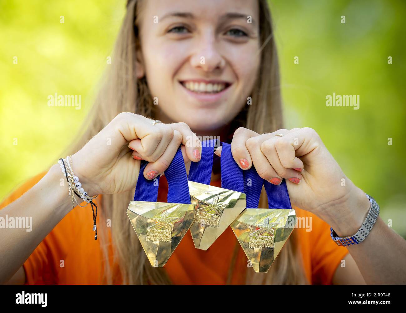 MUNCHEN - Portrait of Femke Bol with her three gold medals she won ...