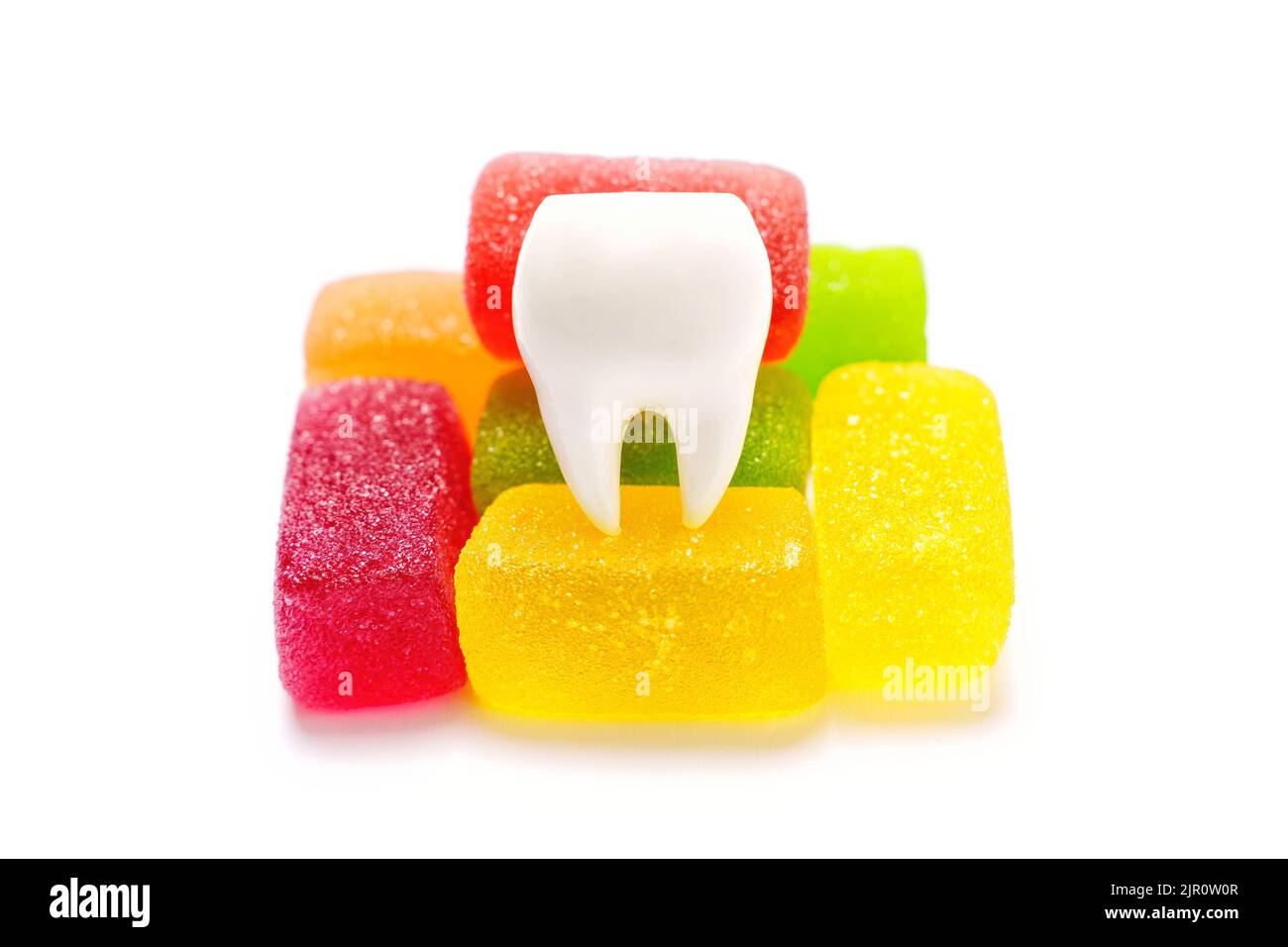 Large tooth model with a bunch of colorful jelly candies isolated on ...