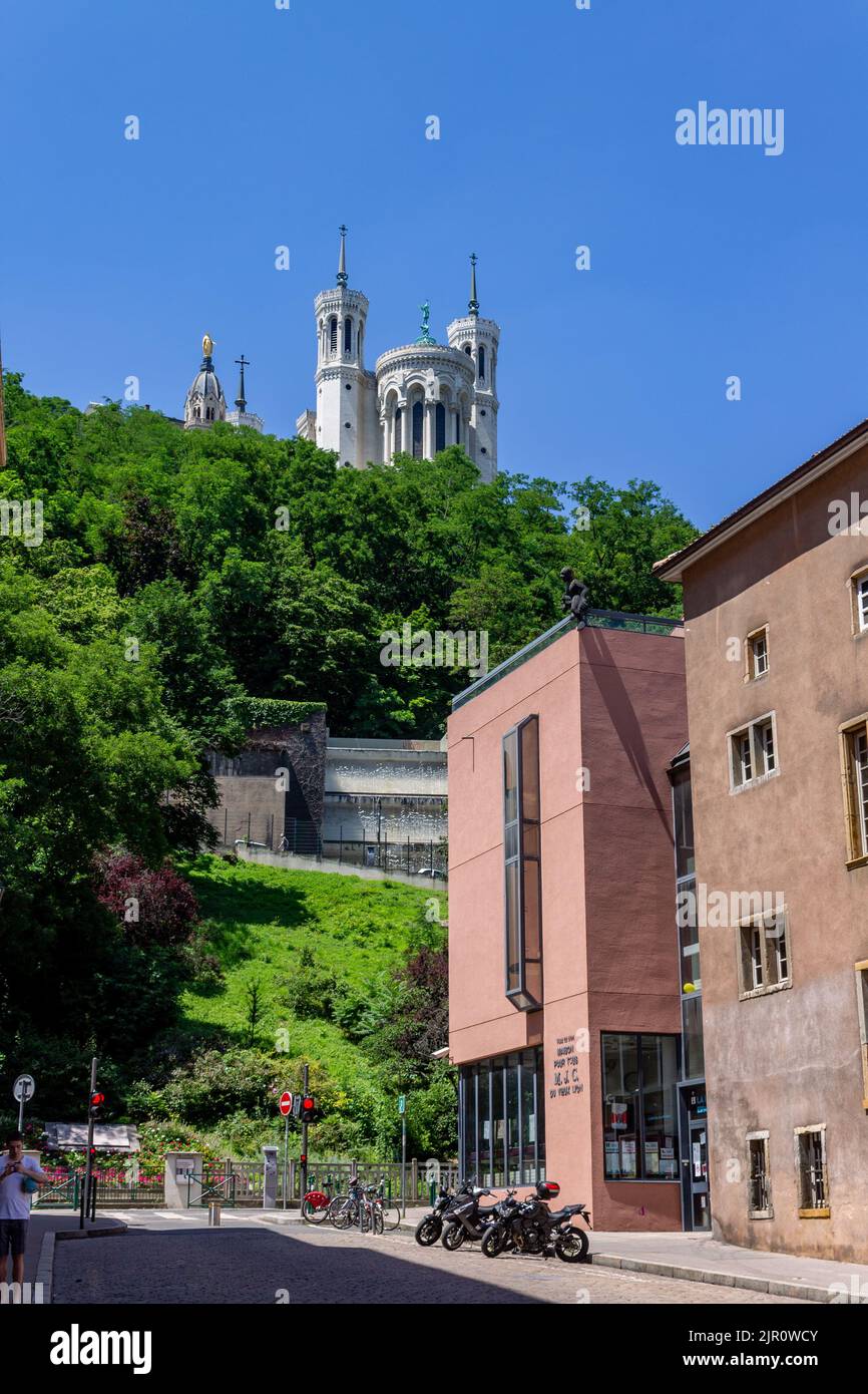 The Basilica of Notre Dame de Fourviere and the historical buildings of downtown Lyon, France ...