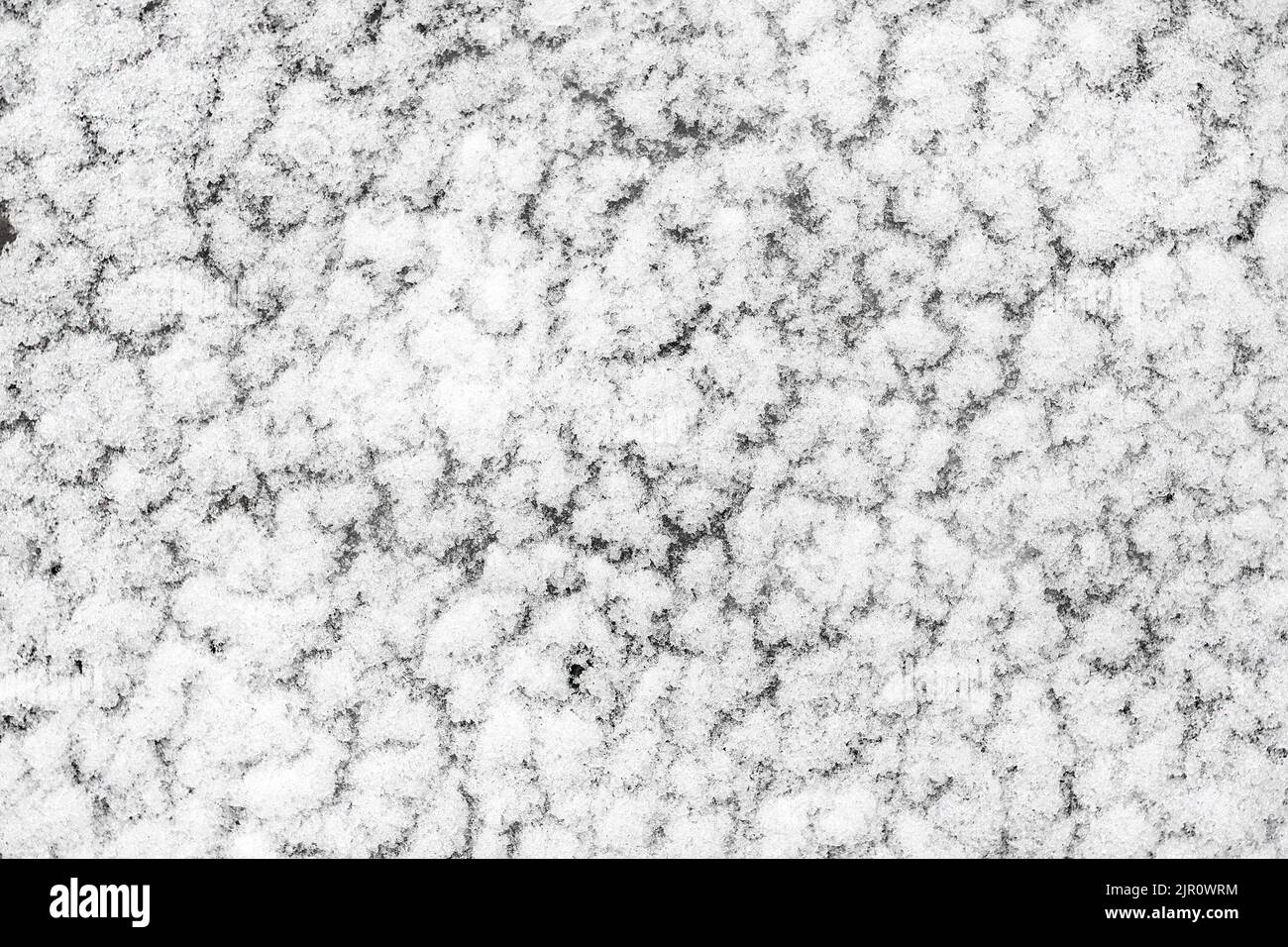 Snow covered with a crust of ice. View directly above Stock Photo - Alamy