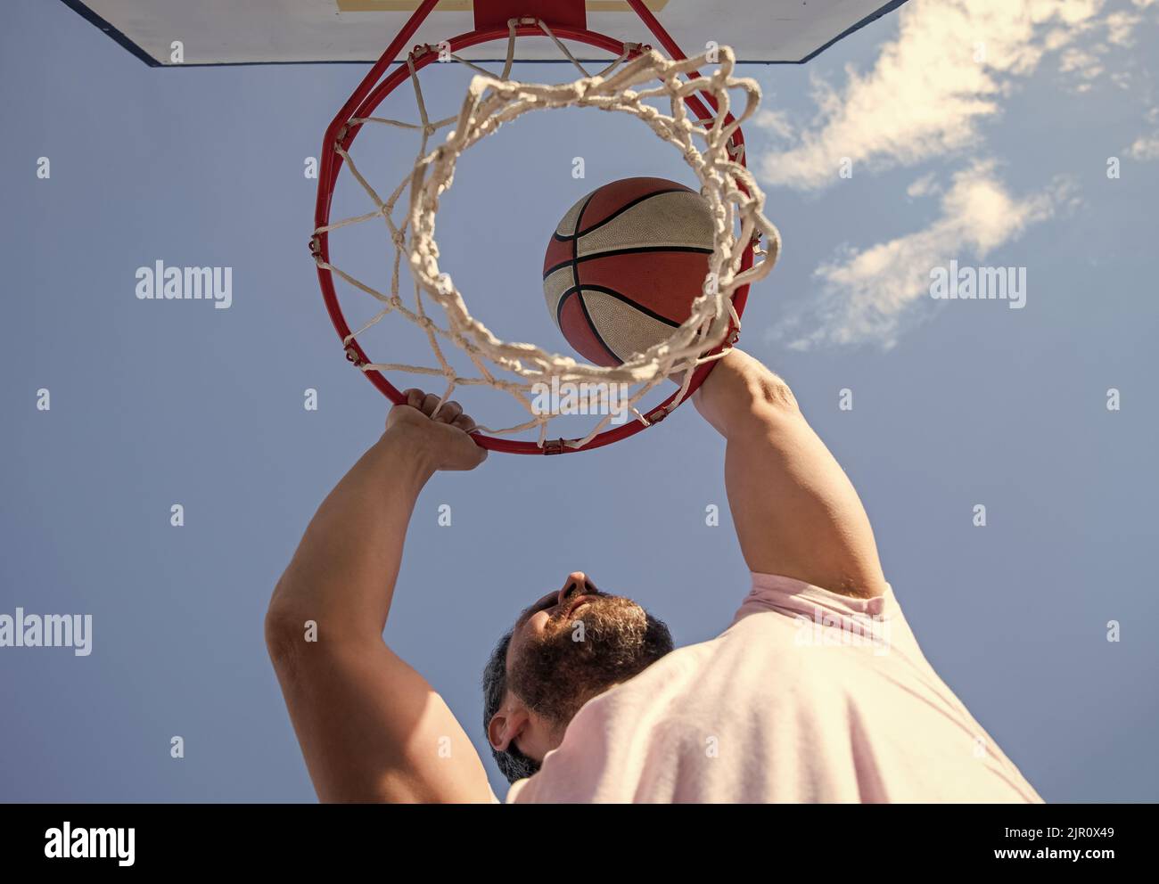 summer activity. man with basketball ball on court. professional ...