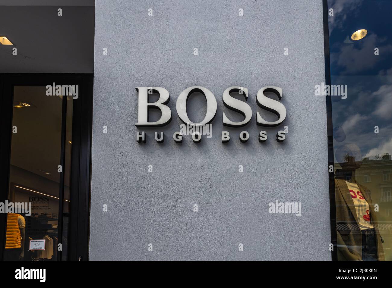 Logotype logo sign of Hugo Boss on the wall of the store. Vilnius ...
