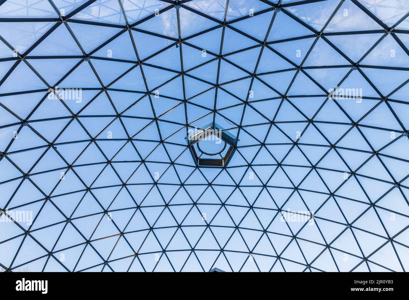 Structural glass facade curving roof of modern architectural building ...