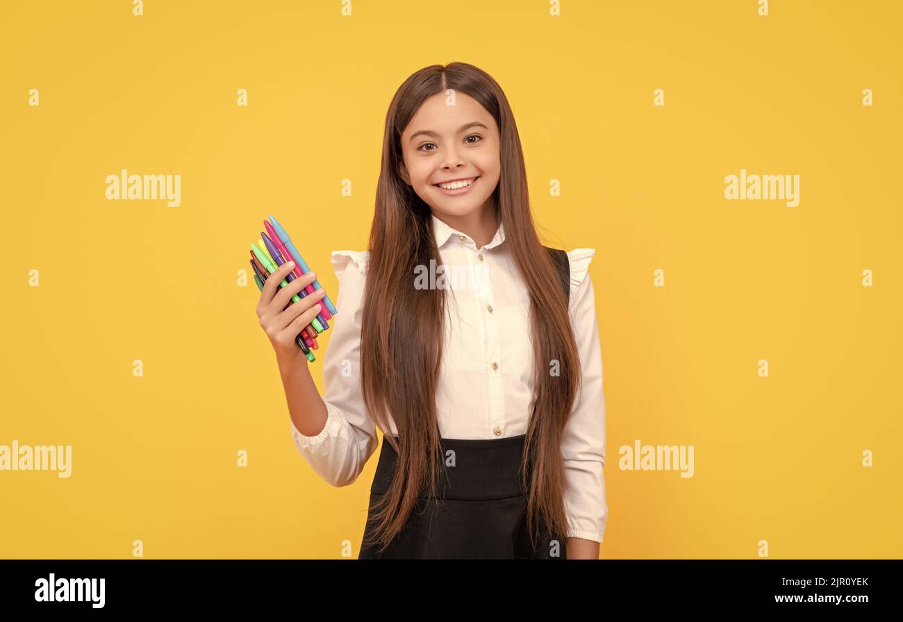 Fun and creativity simultaneously. Happy child hold felt-tip pens ...