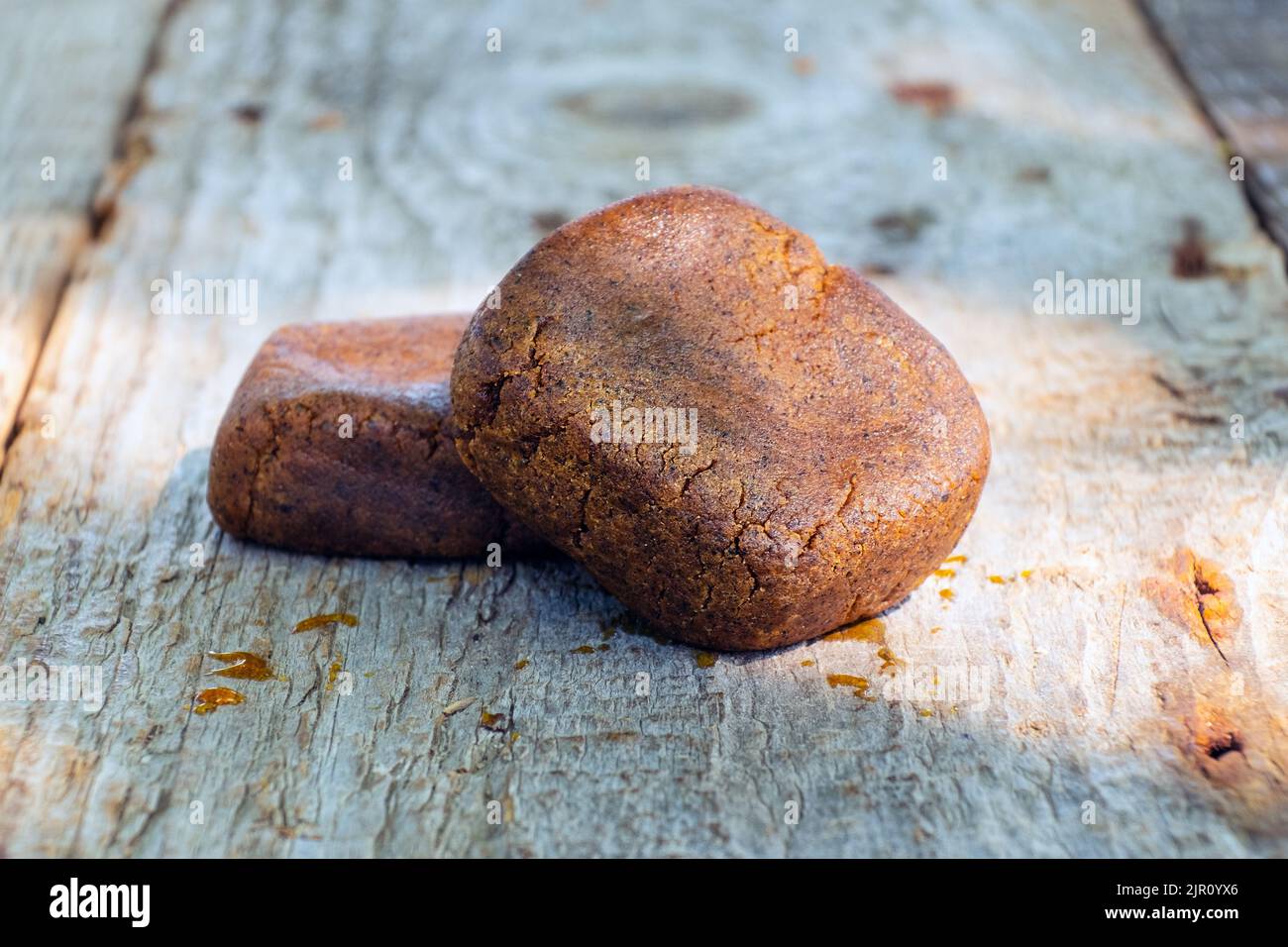 cannabis weed with high thc , brown hashish closeup Stock Photo - Alamy
