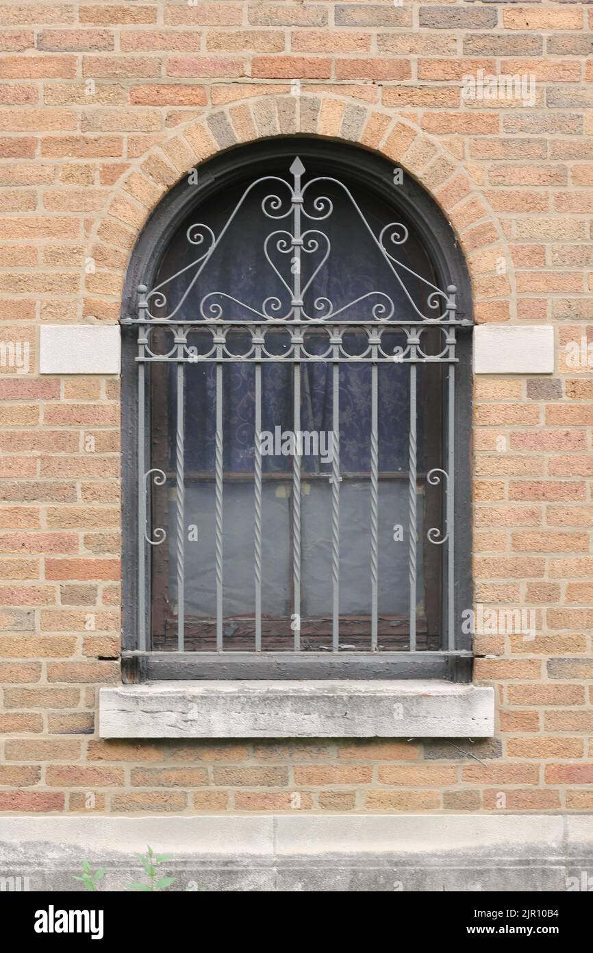 Fancy and ornate wrought iron security grating on a huge window Stock ...
