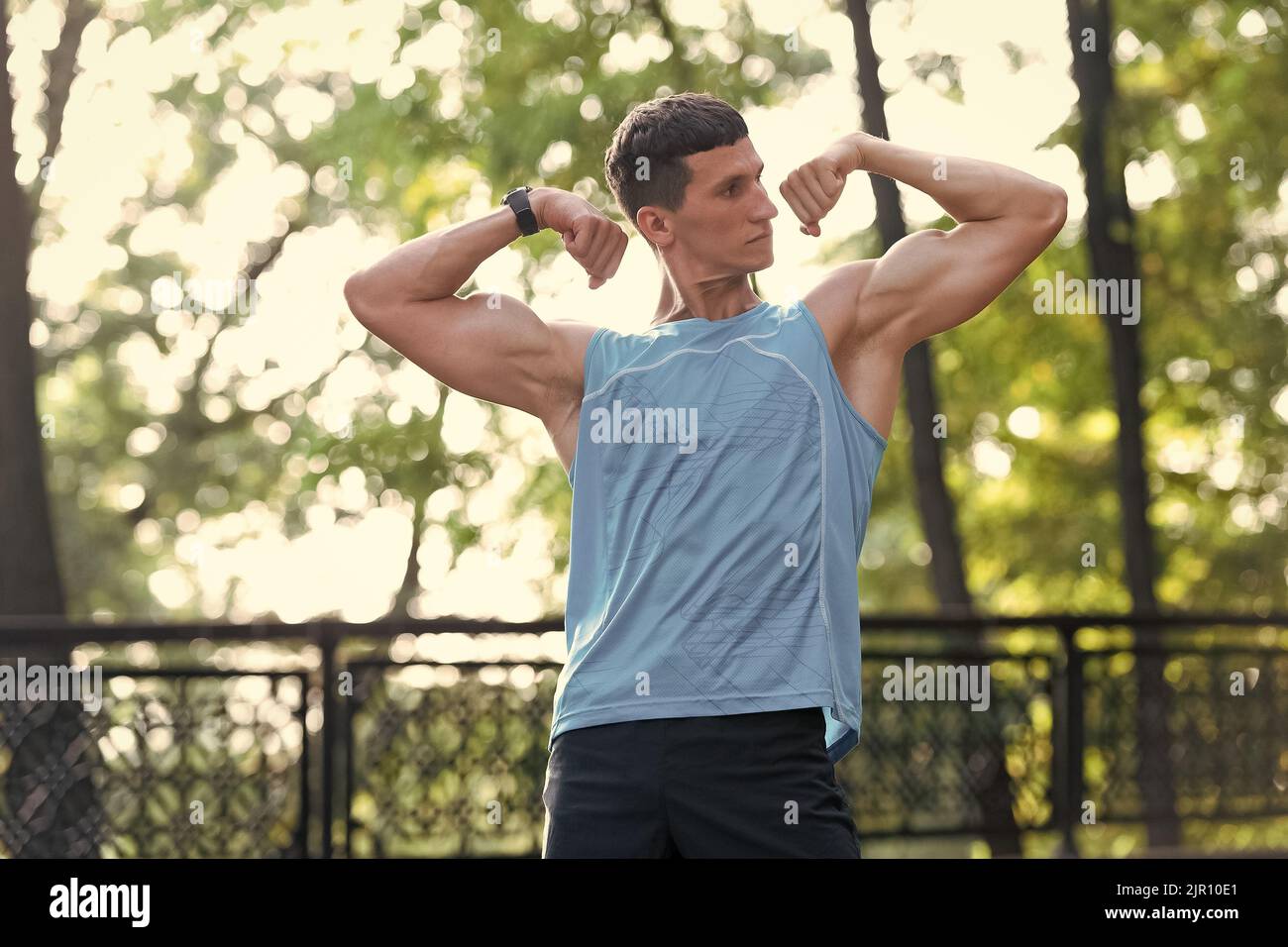 muscular bodybuilder man showing biceps and triceps Stock Photo - Alamy
