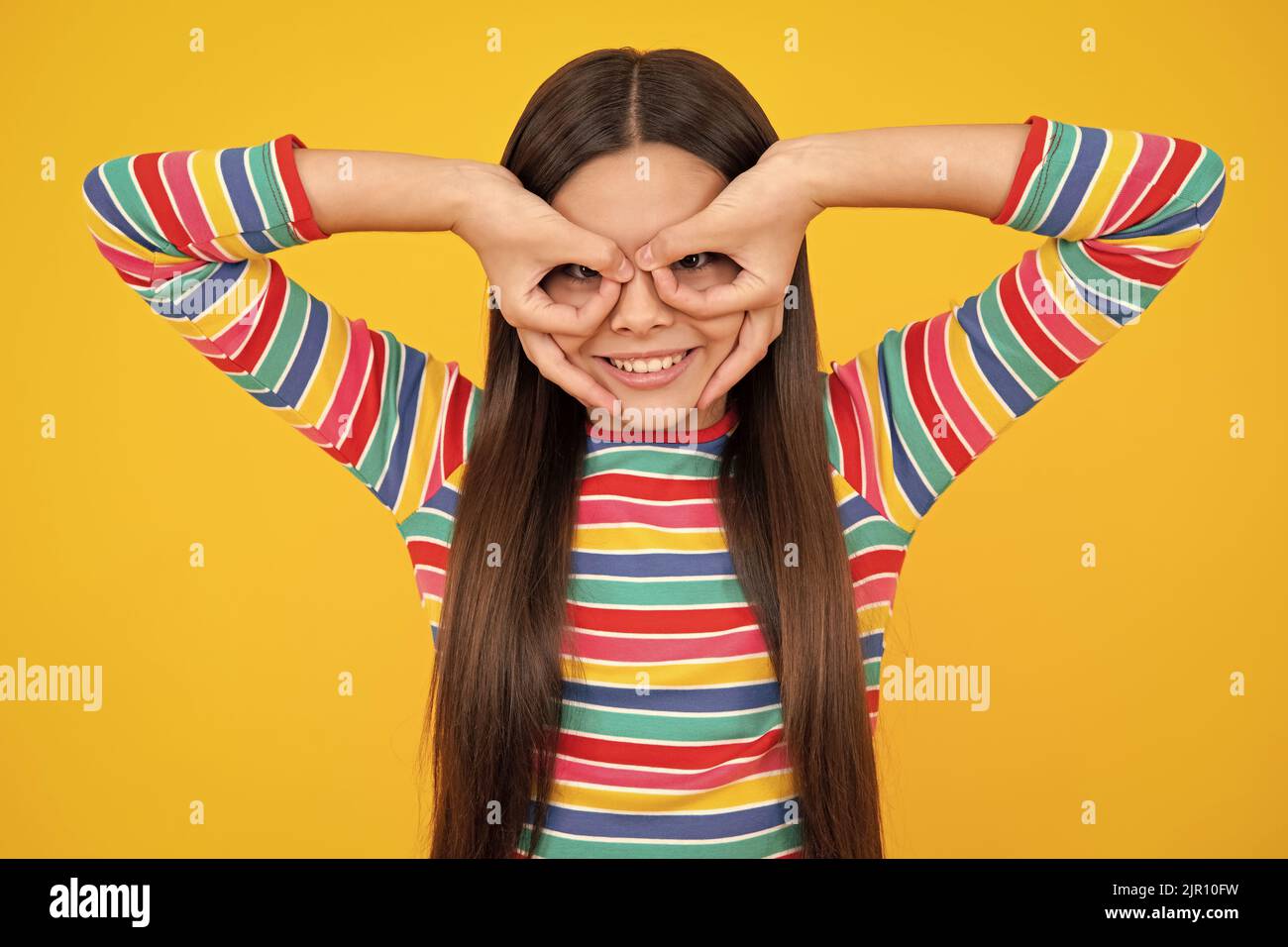 Beautiful teenager child girl look finger specs okey symbol silly ...
