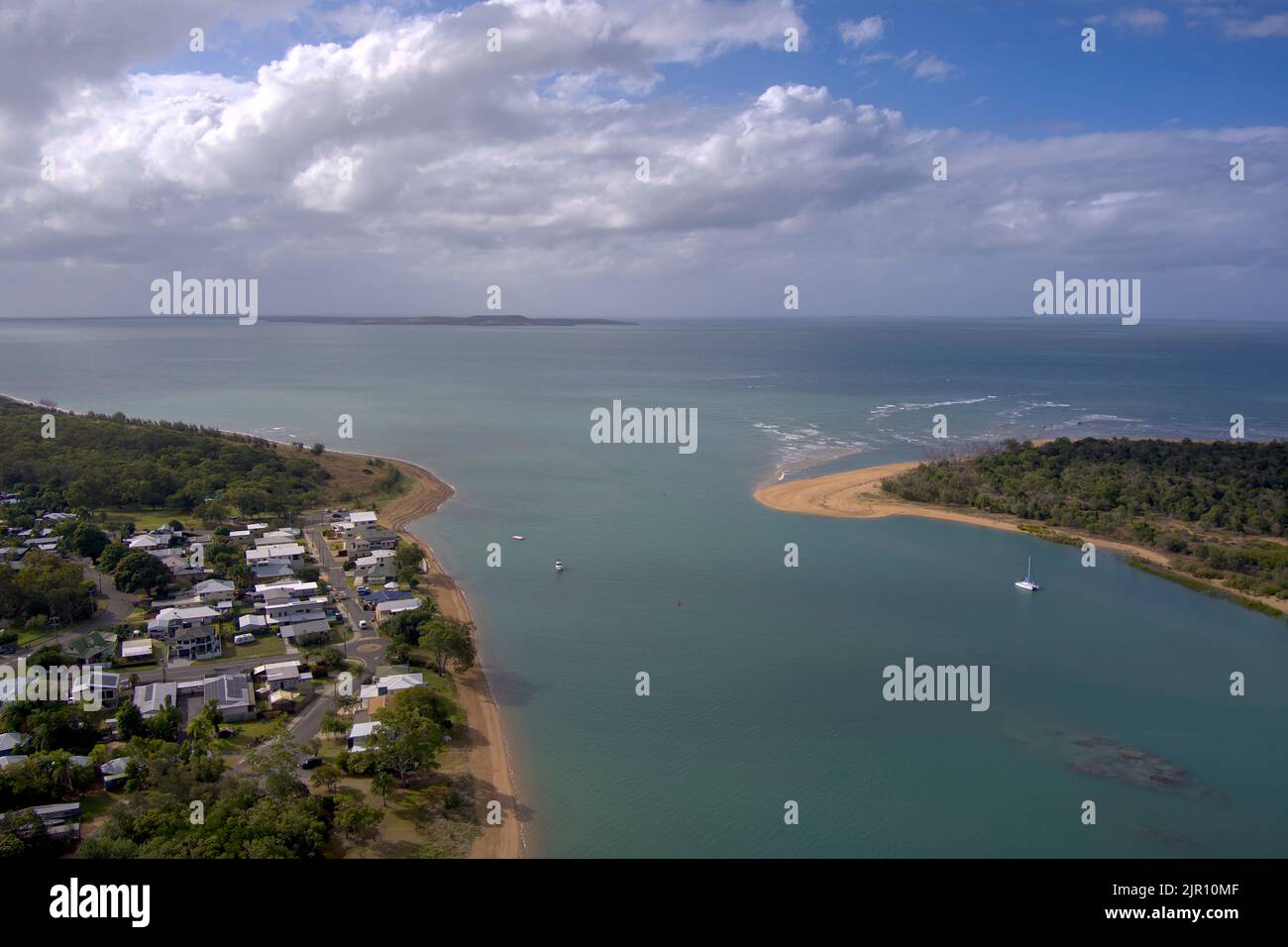 Aerial of waterfront residential houses along Lilley's Beach Boyne ...