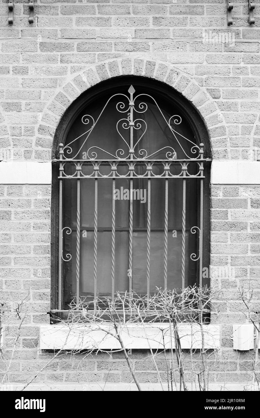 Fancy and ornate wrought iron security grating on a huge window in ...