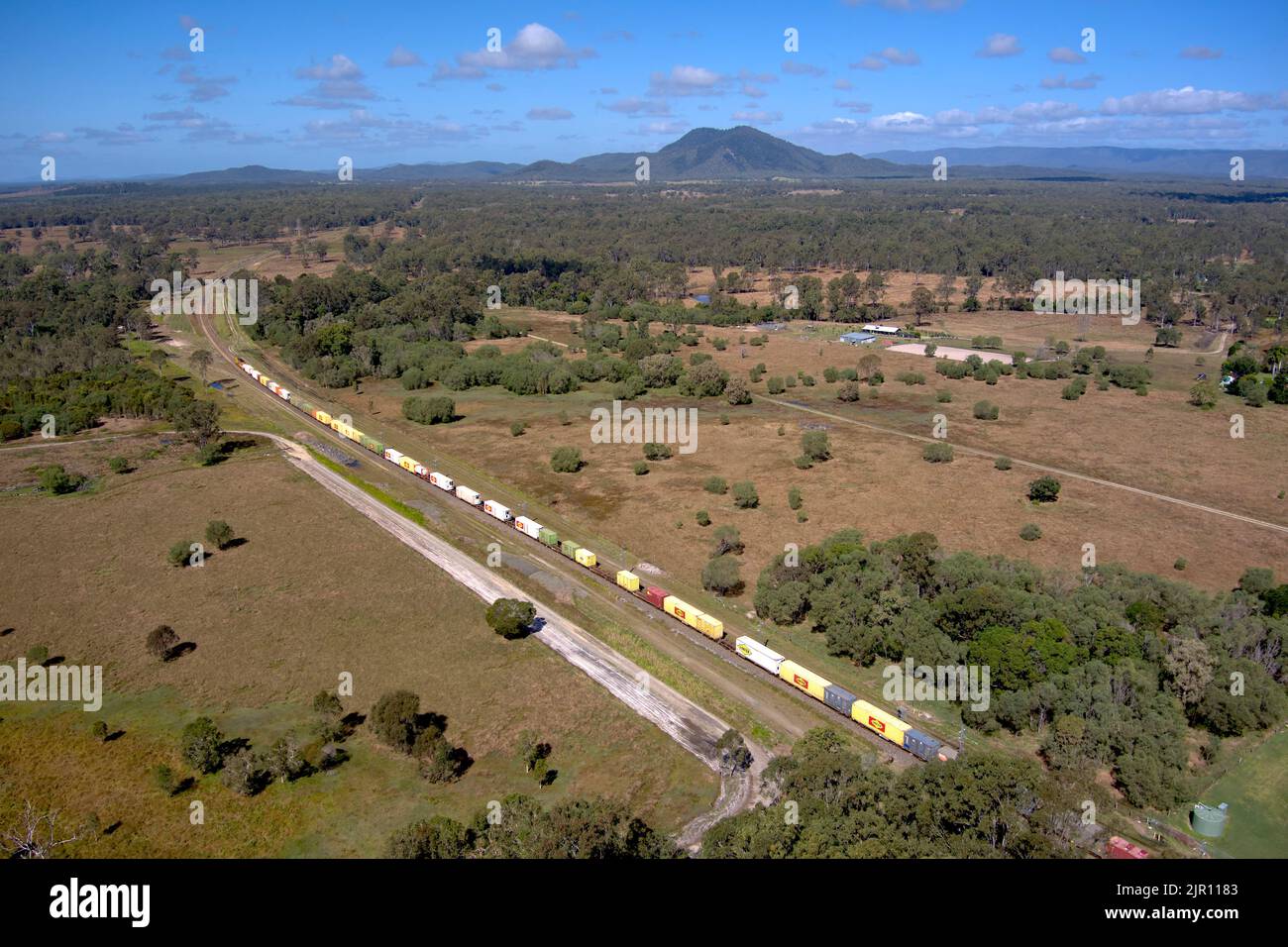 Aerial of general freight train at Miriam Vale Queensland Australia ...